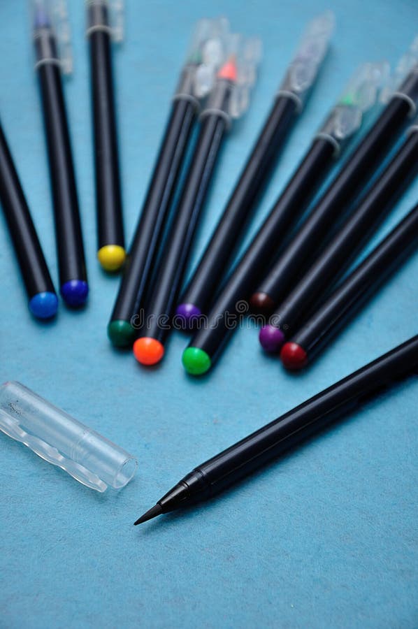 A Black Color Pen with the Rest Out of Focus Stock Image - Image of ...