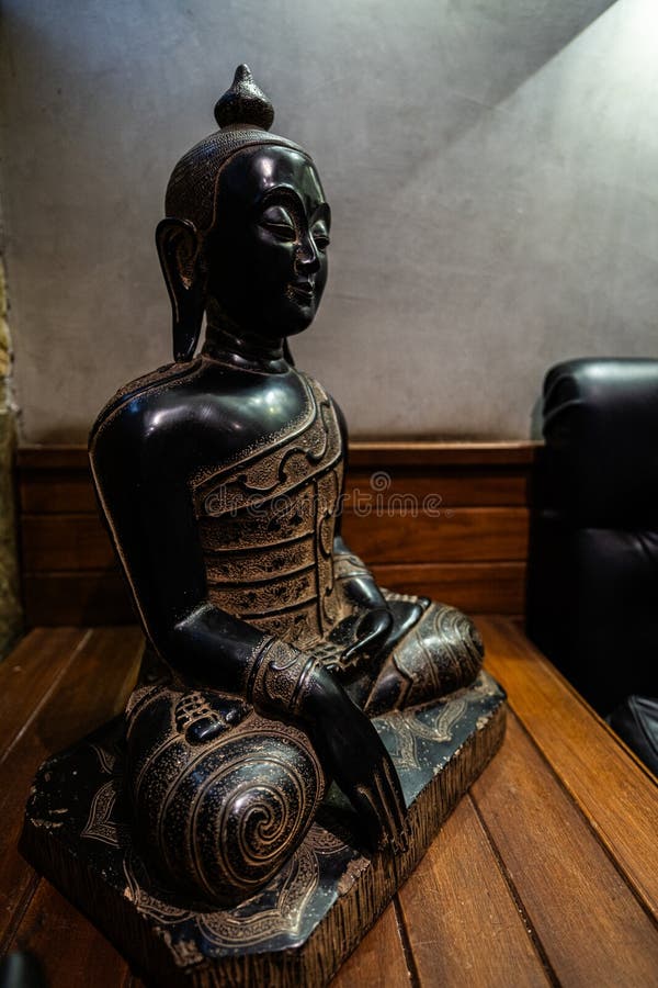 Black Colored Buddha Statue on the Table Stock Photo - Image of ...