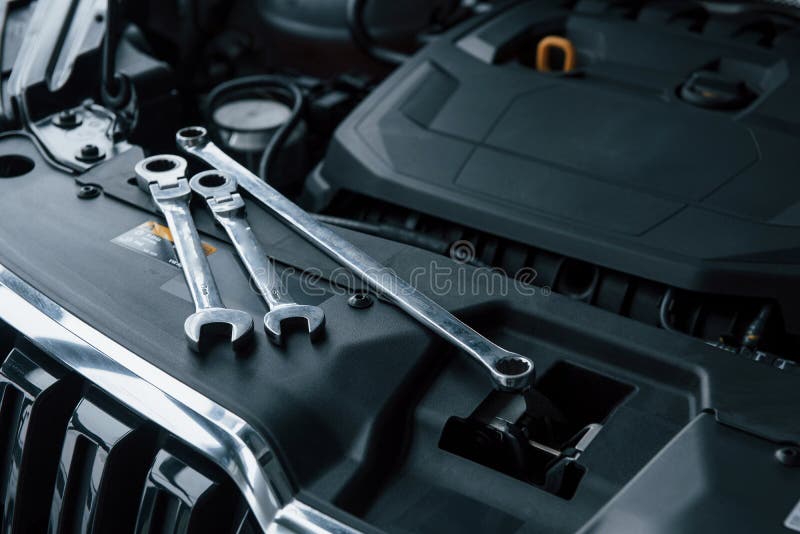 Black Colored Interior. Repair Tools Lying Down on the Engine of ...