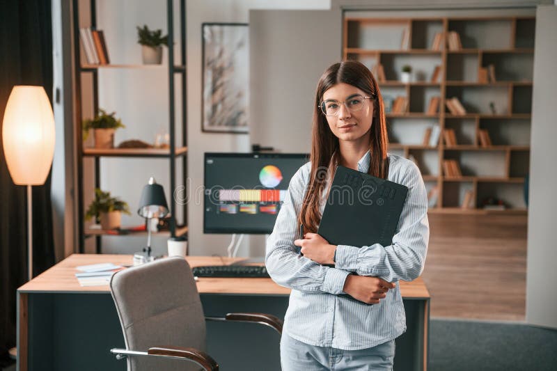 With Black Colored Notepad. Standing and Posing Stock Photo - Image of ...