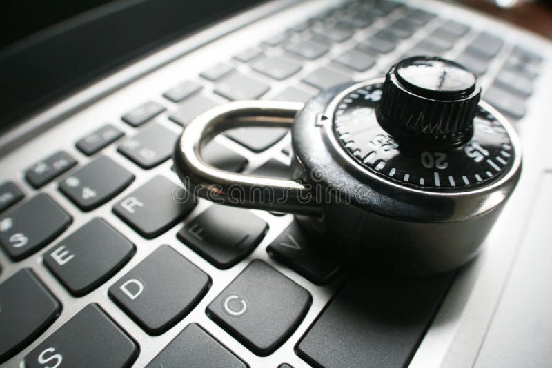 Black Combination Lock on Laptop Keyboard Representing Cyber Security ...