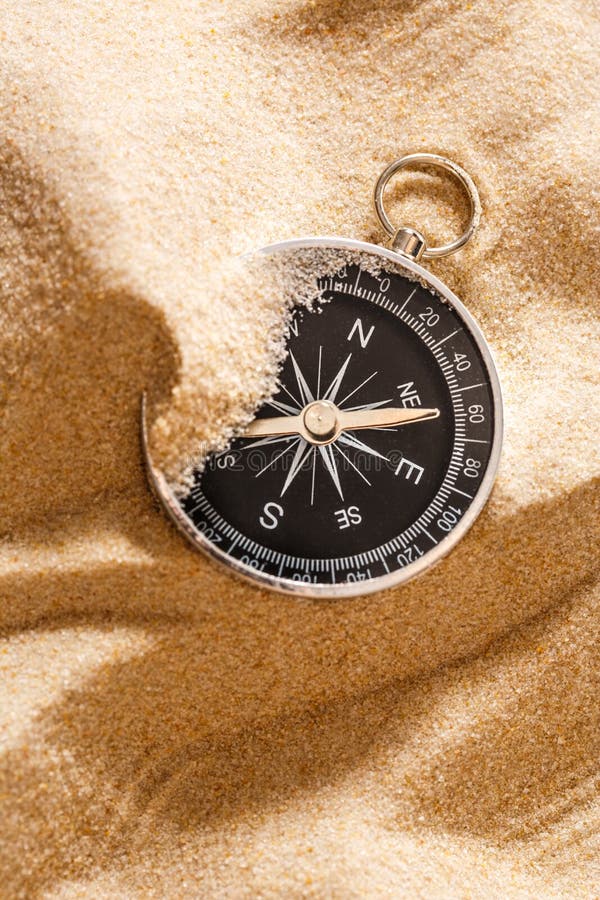 Black Compass in Beach Sand Stock Photo - Image of device, modern: 70353186