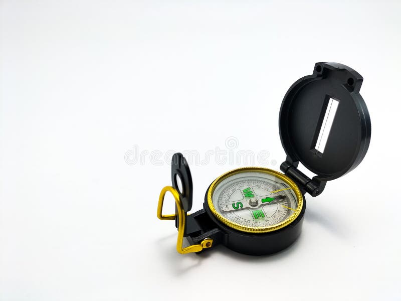 A Black Compass with a Hinged Lid Rests on a White Surface. Stock Photo ...