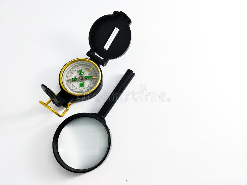 A Black Compass with a Hinged Lid Rests on a White Surface. Stock Image ...