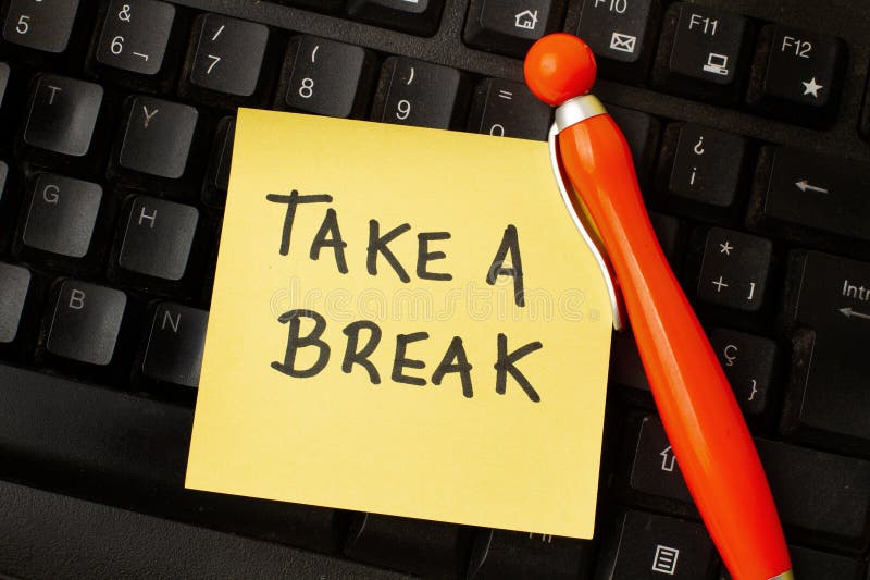 Black Computer Keyboard with a Yellow Paper Note with Take a Break ...