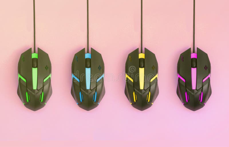 Black Computer Mouses Hang on Pastel Pink Background Stock Photo ...