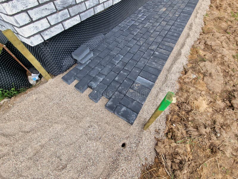 Black Concrete Brick Pavement during Laying Process Stock Image - Image ...