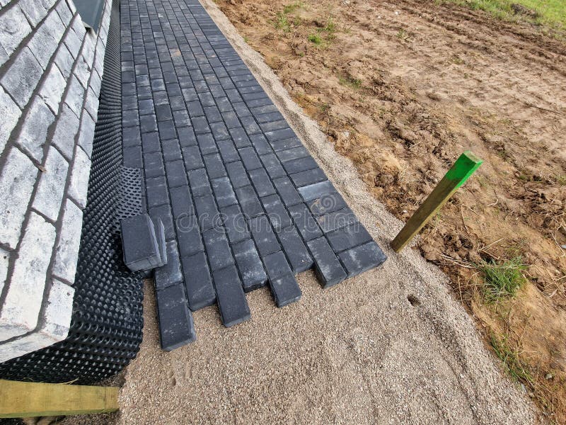 Black Concrete Brick Pavement during Laying Process Stock Image - Image ...