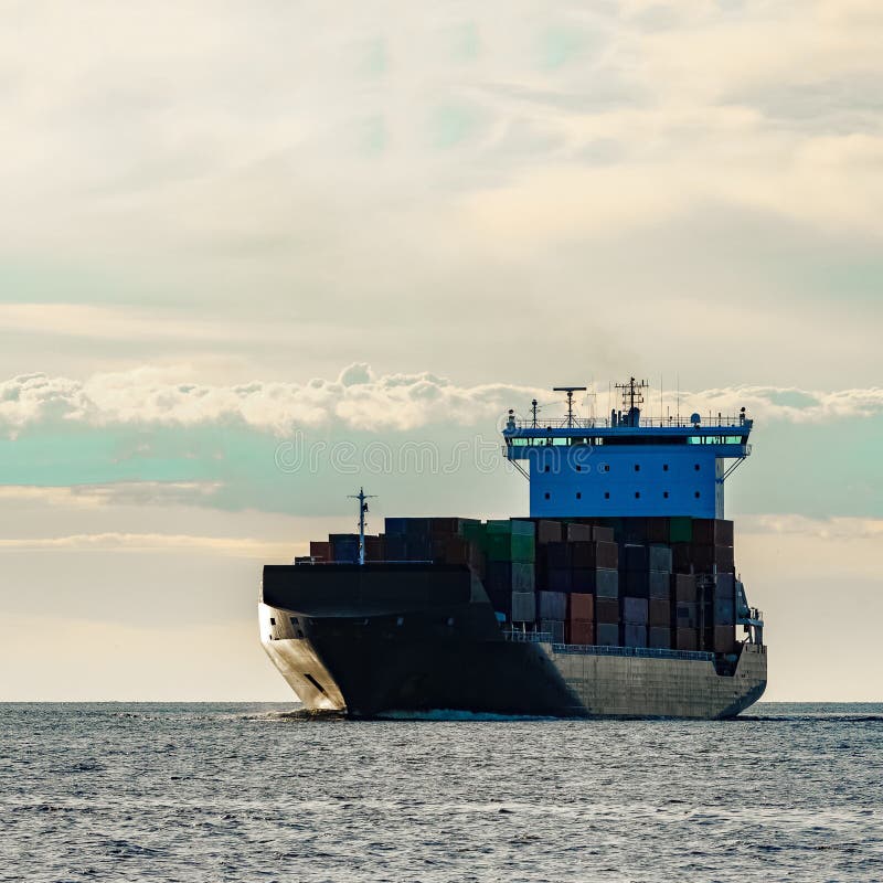 Black Container Ship Underway Stock Photo - Image of clouds, boat ...