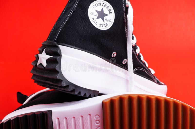 Black Converse Chuck Taylor All Star High Sneaker on a Red Background ...