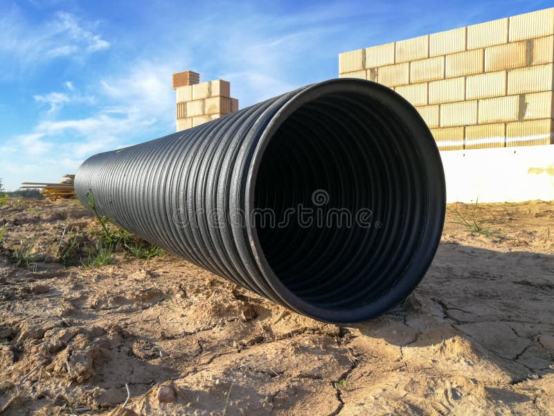 Black Corrugated Pipe for Water Canalization Stock Image - Image of ...