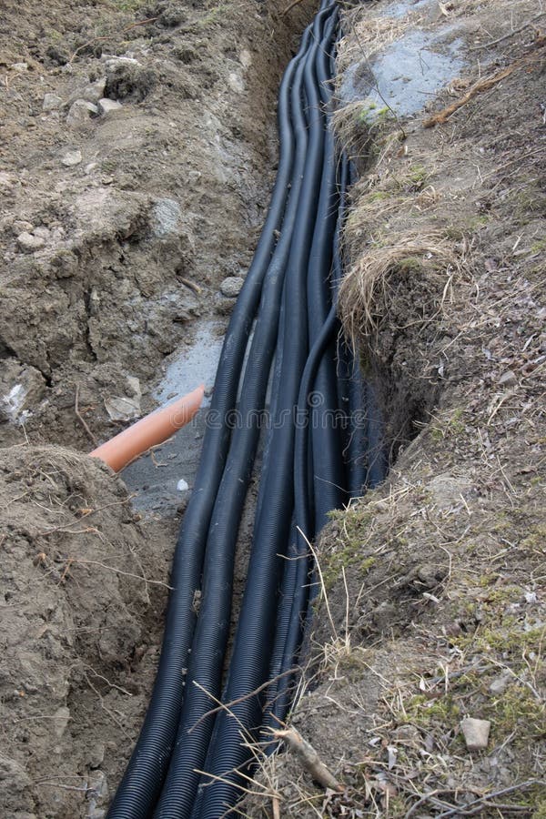 Black Corrugated Plastic Drainage Pipes Laying in a Ditch at a ...