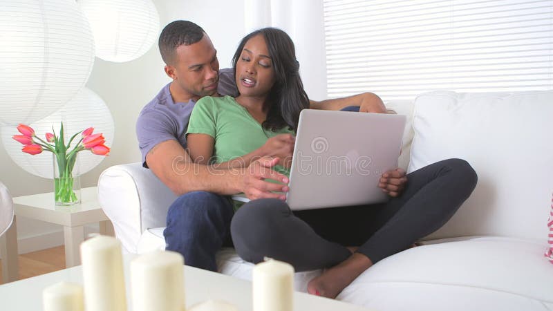 Black Couple Browsing the Internet on Laptop Stock Video - Video of ...