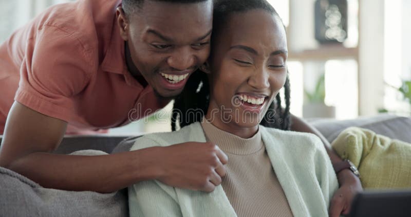 Old Couple On Couch With Tablet Relax And Smile With Love Interracial