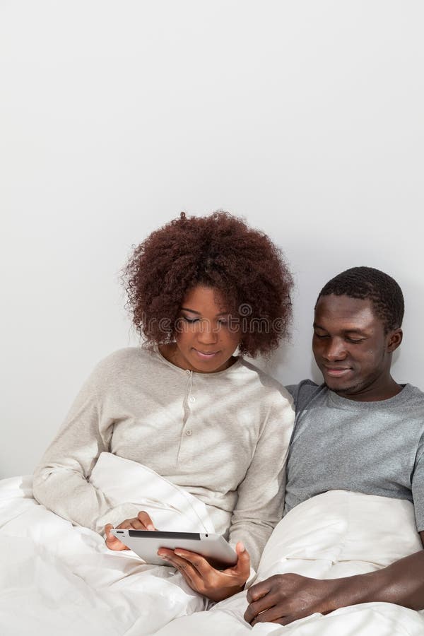 Black Couple in Love Using the Computer Stock Image - Image of bedroom ...