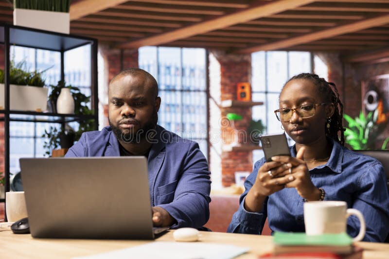 Black Couple at Their Home Office Working Remotely on daily Tasks Stock ...