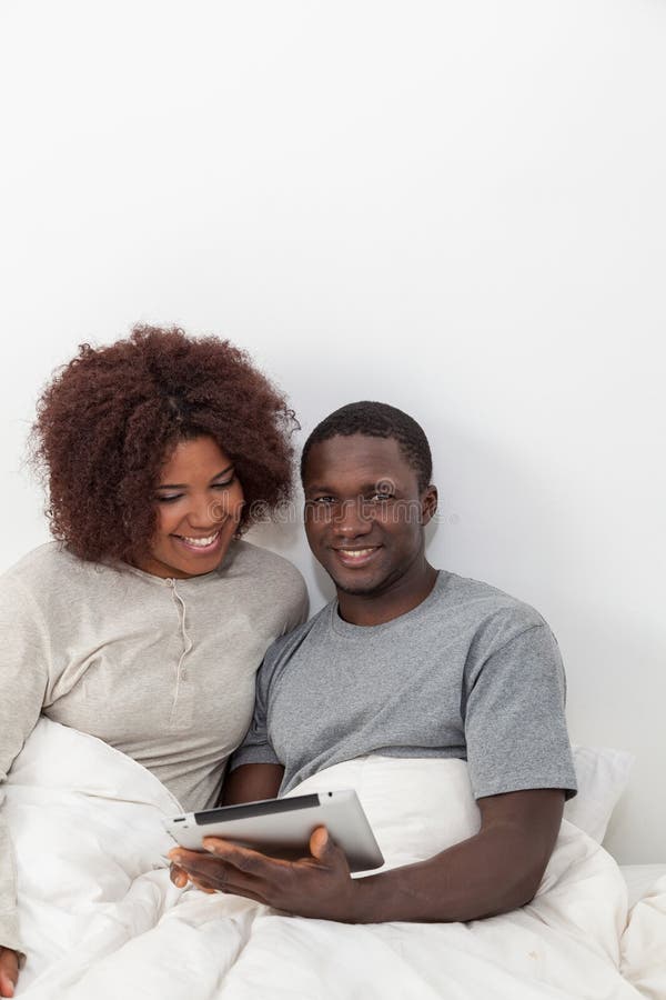 Black Couple Using the Ipad Stock Photo - Image of laptop, house: 62745974