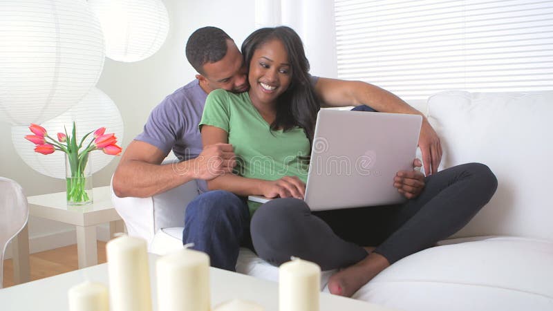 Black Couple Using a Laptop on Couch Stock Video - Video of kiss ...