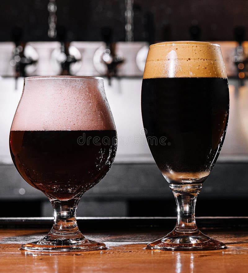 Black Craft Beer in Glasses on Table in Pub Interior Stock Photo ...