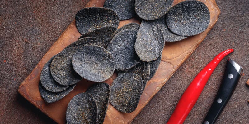 Black Crisps on a Stone Plate. Black Food Stock Image - Image of ...
