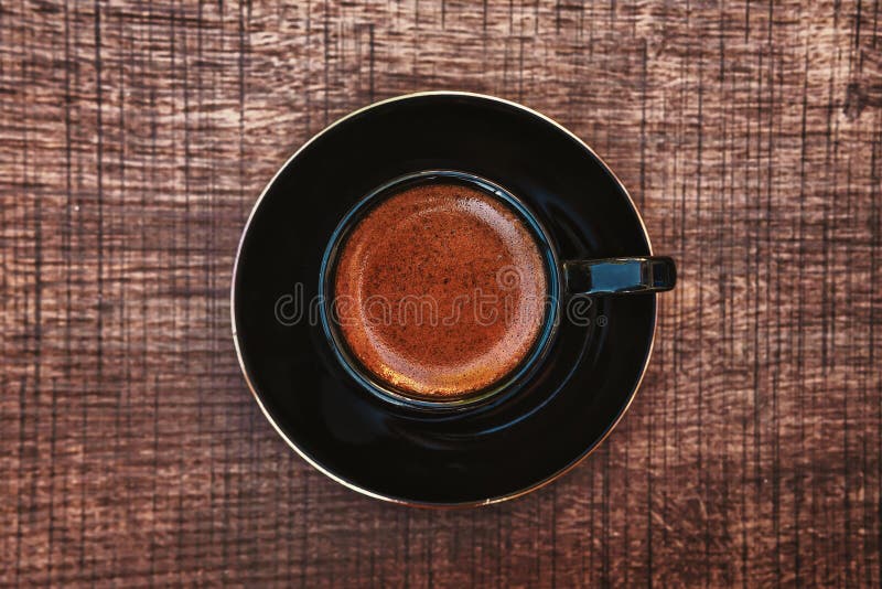 Black Cup of Coffee on the Wooden Table, Top View Stock Photo - Image ...