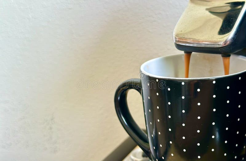 Black Cup with White Dots, Flowing Coffee and Minimalistic Background ...