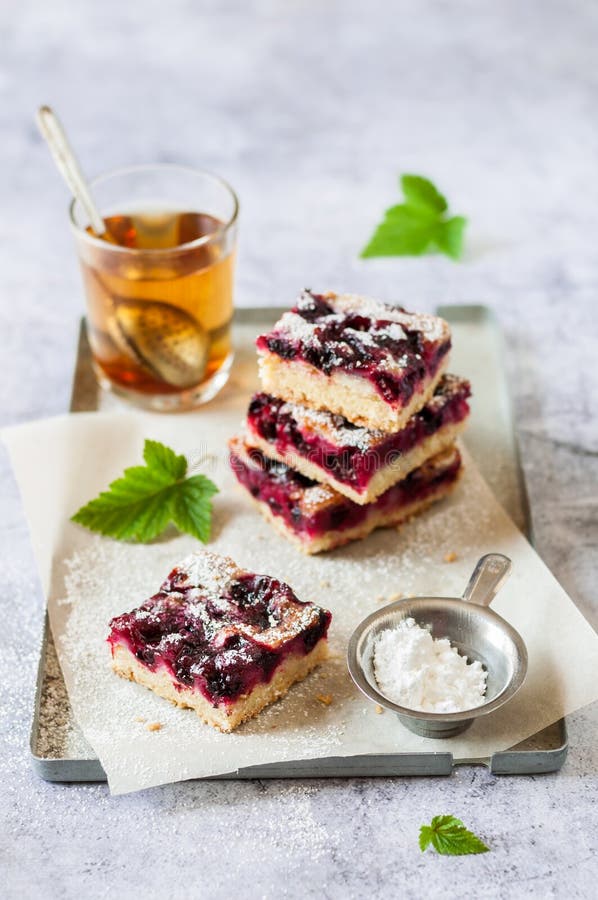 Black Currant Slice with a Glass of Tea Stock Image - Image of icing ...