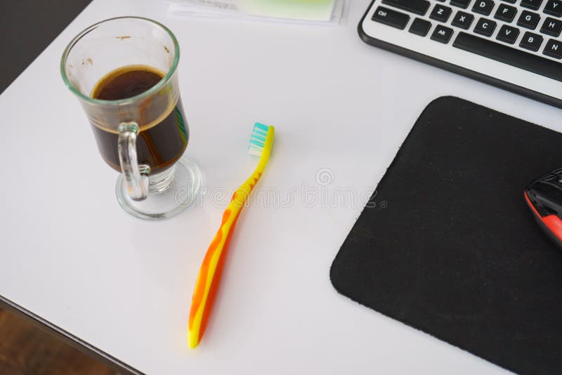 Black Dark Espresso Coffee and Toothbrush on Table Stock Image - Image ...