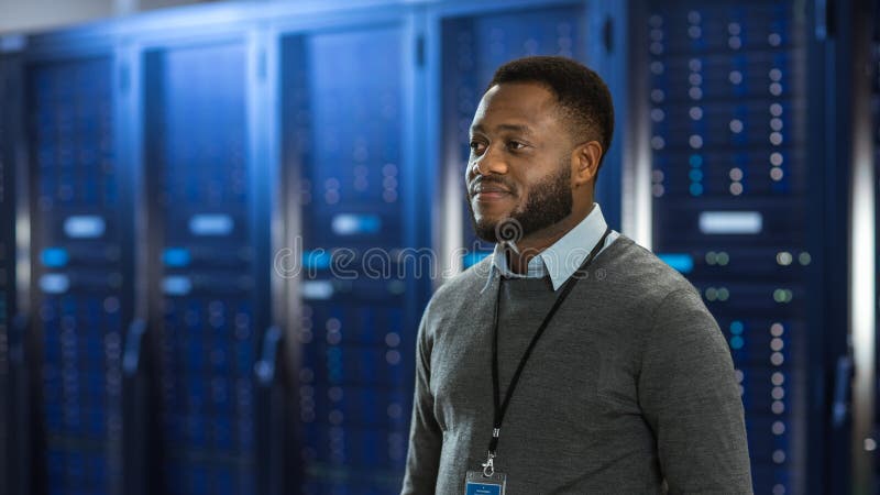 Black Data Center it Technician Standing in the Middle of a Server Rack ...