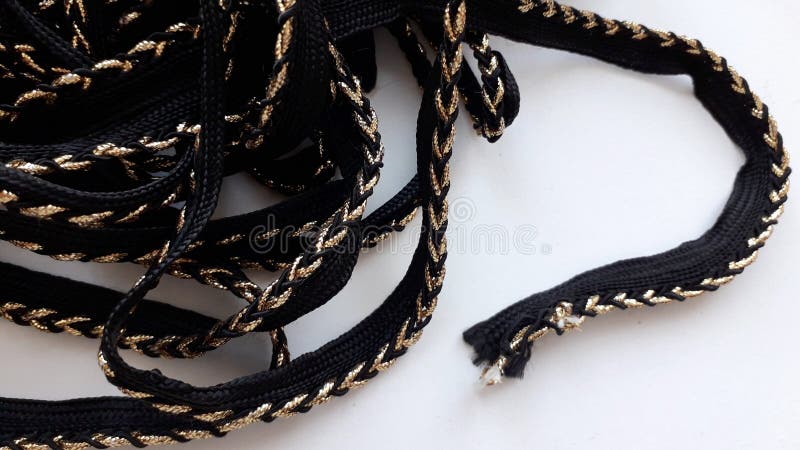 Black Decorative Ribbon on a Light Background. Decorative Trim. Stock ...