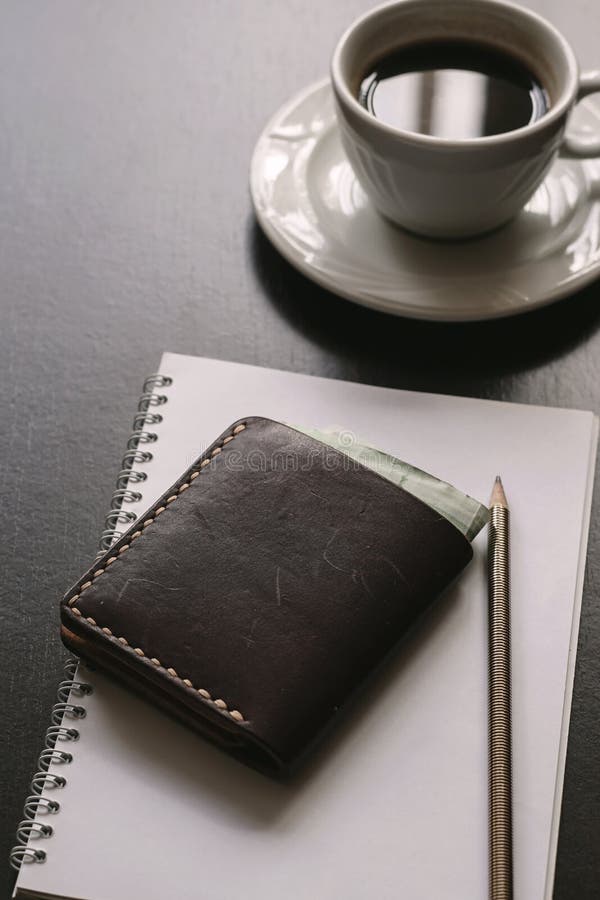 Black Desk with Coffee,Wallet, Paper and Pen Stock Photo - Image of ...