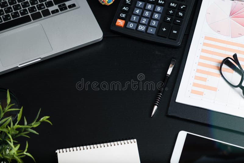 Black Desk with Computer Graph and Calculator Stock Image - Image of ...