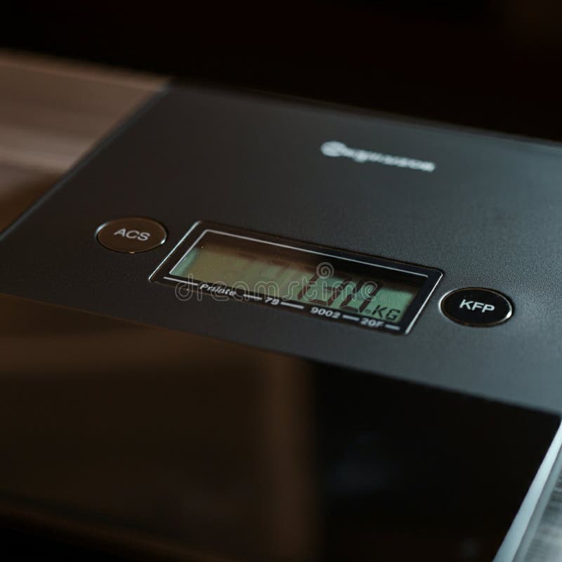 Black Digital Kitchen Scale with an LCD Display Showing Weight in ...