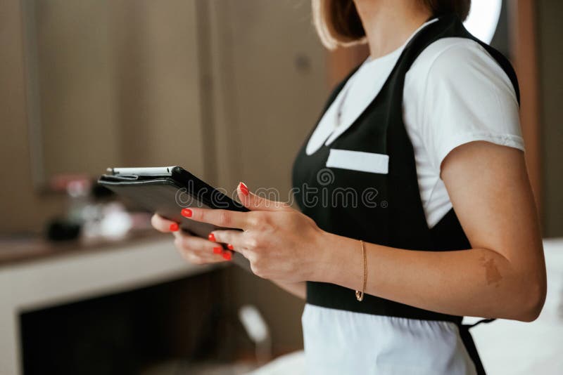 Black Digital Tablet in Hands. Young Chambermaid is in Hotel Room Stock ...