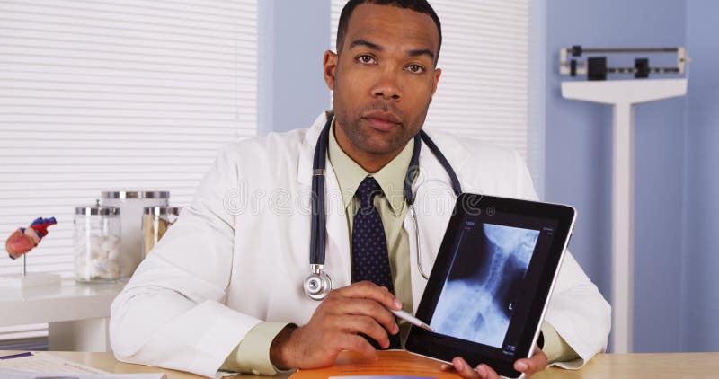 Black Doctor Talking To Camera Stock Image - Image of camera ...
