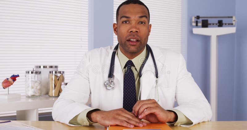 Black Doctor Talking To Camera Stock Image - Image of hospital ...