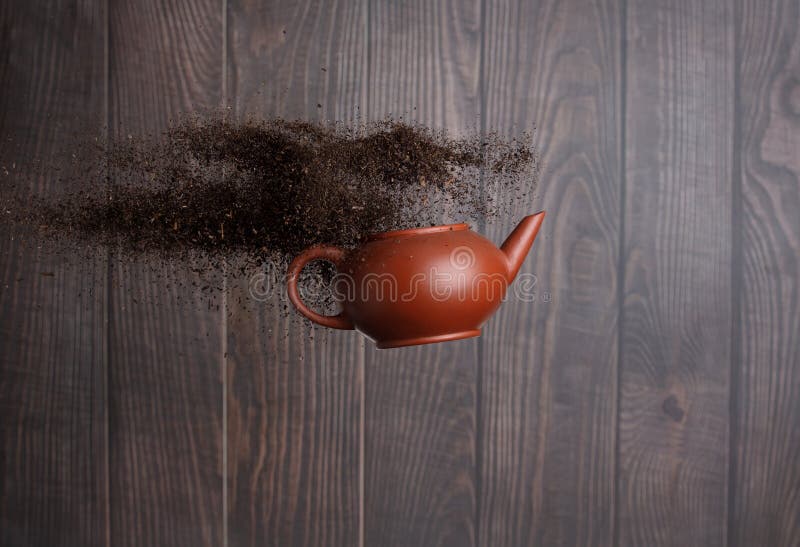 Black Dried Leave Tea Fly in Pot. Small Fine Size Tea Leaf Flying ...