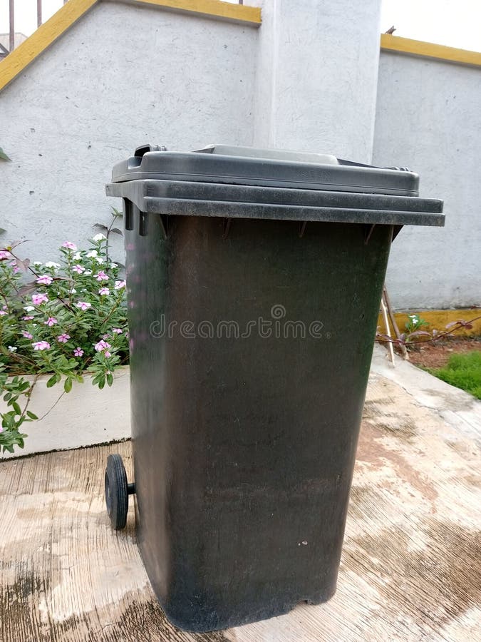 Black Dustbin on a Compound Stock Photo - Image of plastic, compound ...