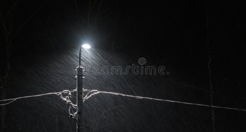 Black Electric Lamp Post With Lighted Lamp During Nighttime Stock Image ...