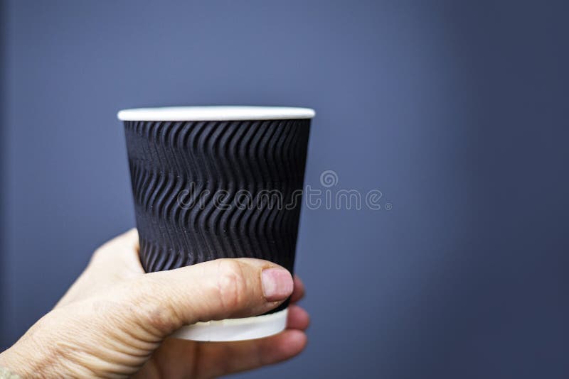 Black Embossed Disposable Cup on a Gray Background. Mockup for Design ...