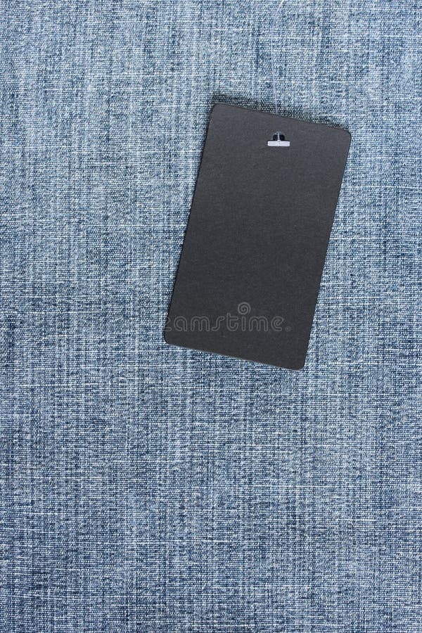 Black Empty Label on a Rope on Blue Denim, Top View Stock Photo - Image ...