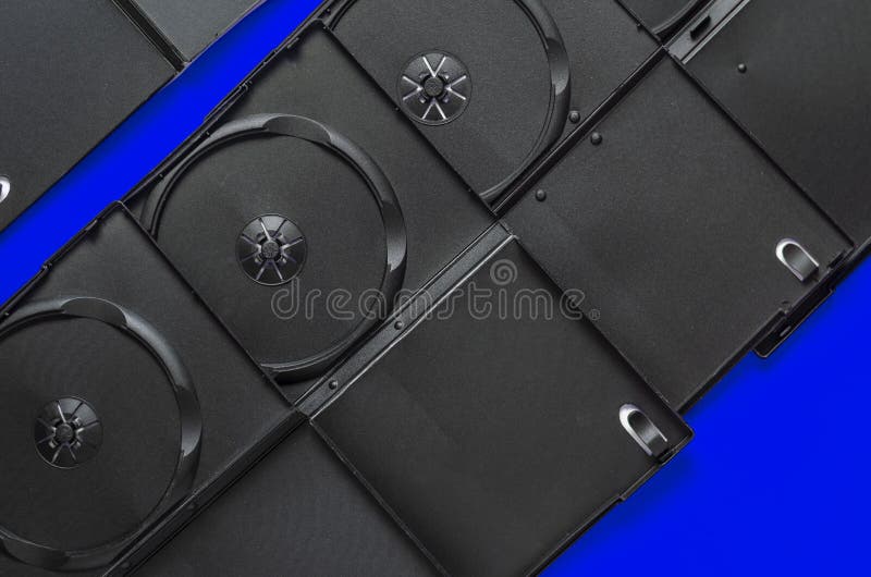 Black Empty Open Boxes for DVD Discs on a Blue Background Stock Photo ...