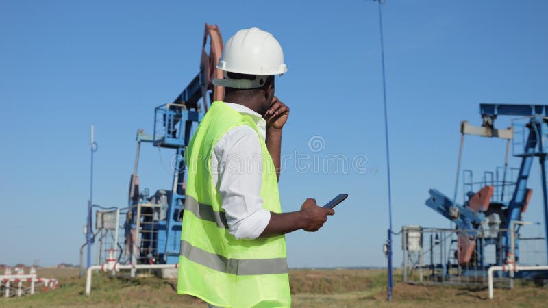 Black Engineer Controls Development of Oil by Jack-pump Stock Video ...