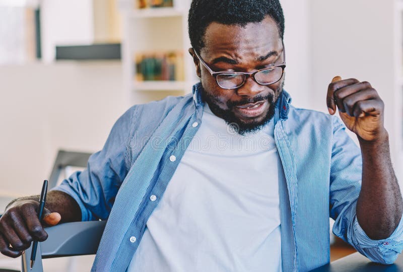 Black Engineer Reviewing Blueprint in Office Stock Photo - Image of ...