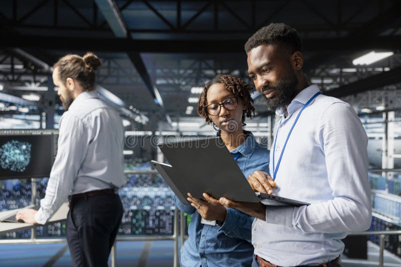 Black Engineering Team Doing Maintenance on Server Rigs for AI Processing Tasks Stock Photo ...