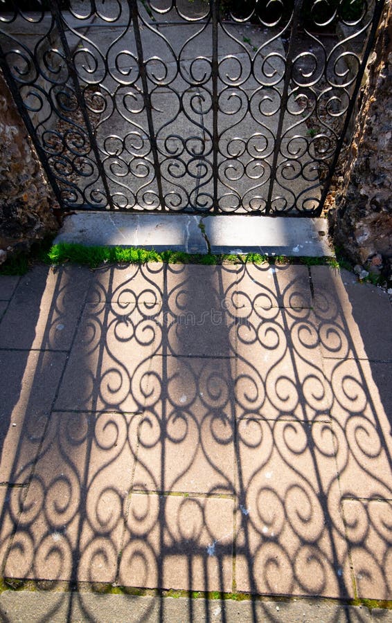 Black Entrance Cast Iron Gate with Shadow on the Ground Stock Image ...