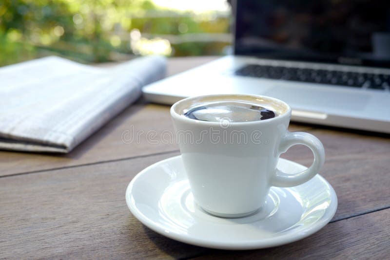Black Espresso Cup of Coffee with Newspaper and Computer Stock Photo ...