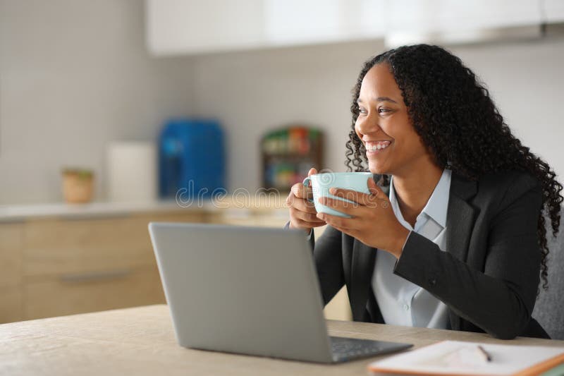 Black Executive Taking a Coffee Break while Working at Home Stock Photo ...