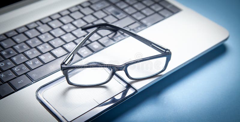Black Eyeglasses on the Laptop Keyboard Stock Photo - Image of modern ...