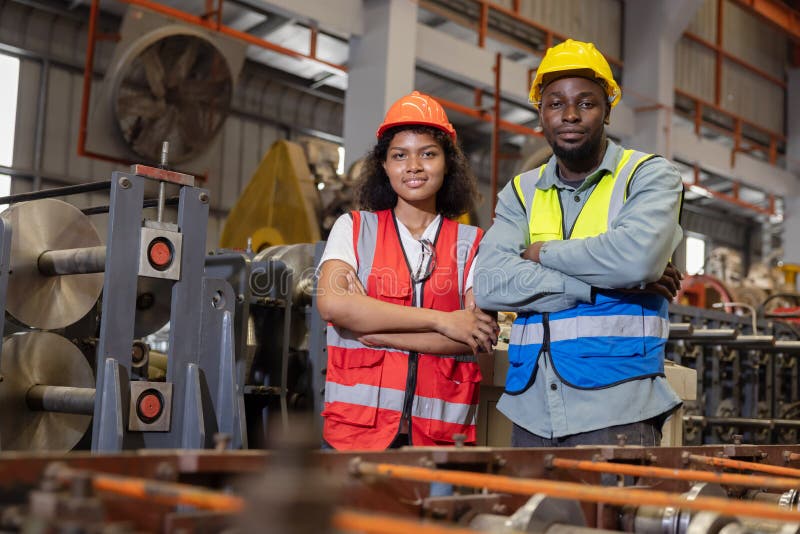 Black Factory Engineers Standing with Folded Arm Pose Stock Photo ...